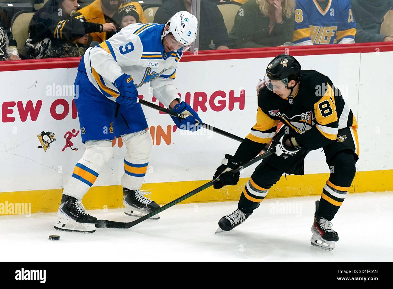 Pittsburgh Penguins' Ben Kindel (81) reaches for the puck against St ...