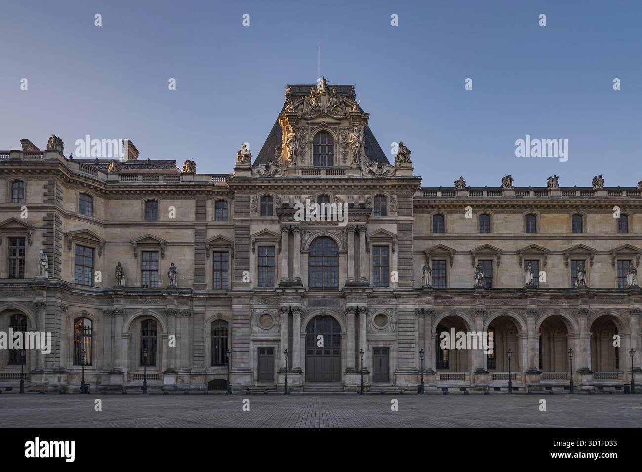 View of the famous Louvre museum at sunrise. The most visited museum ...