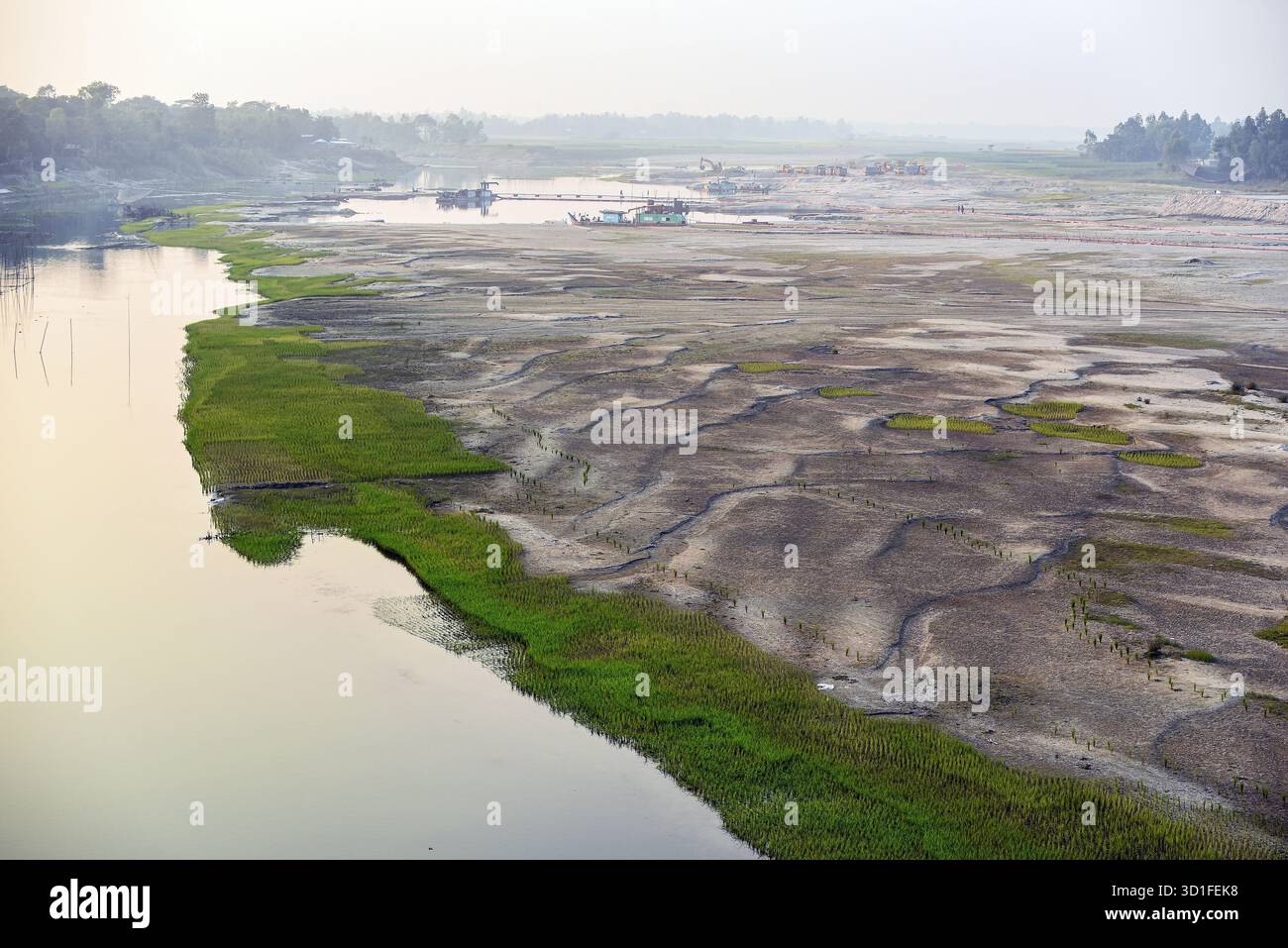 Aerial View Of Green Marsh Wetland Along Shallow Shoreline And Wate ...