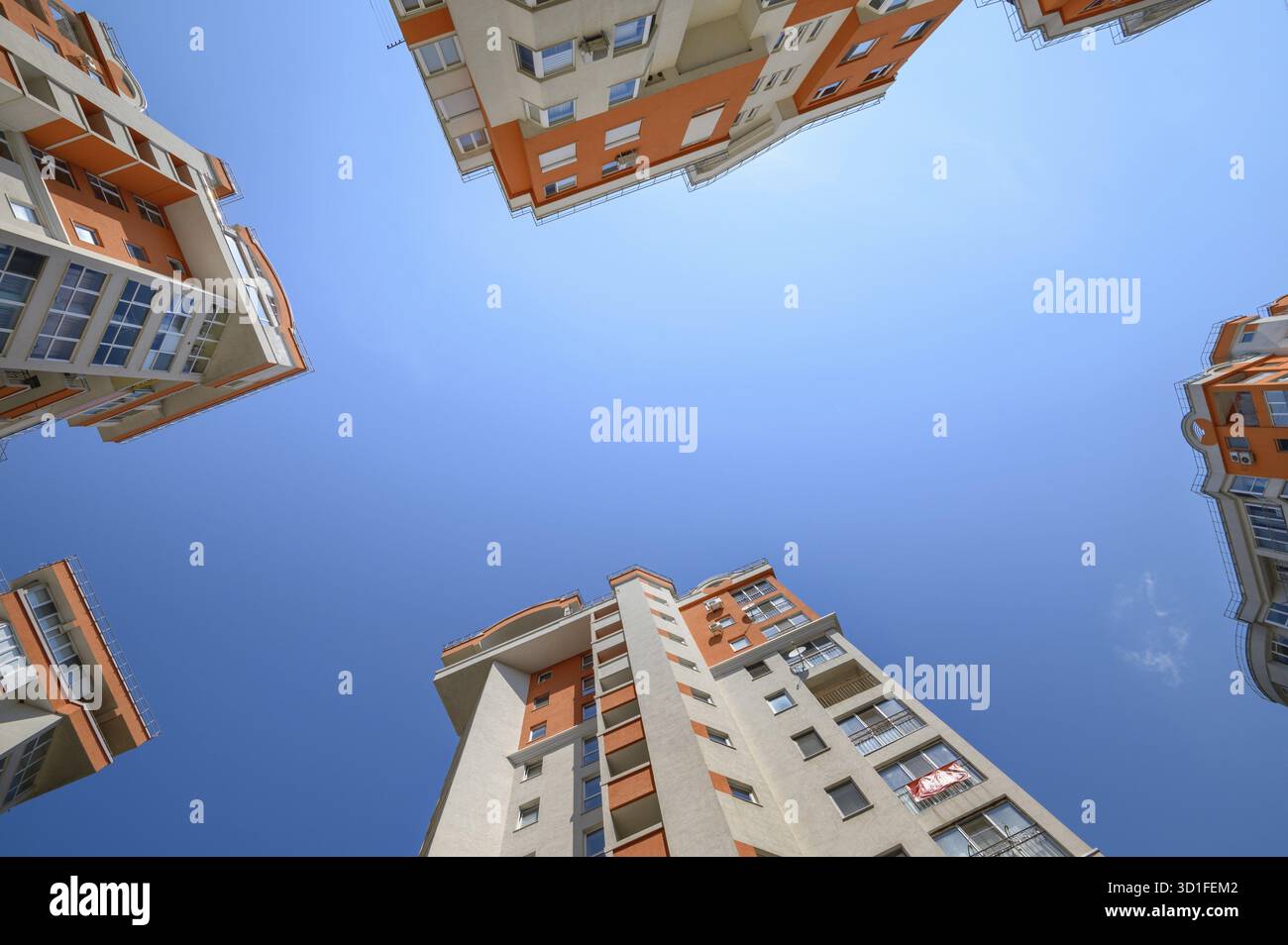 Brand new modern apartment buildings shot from below using wide angle ...