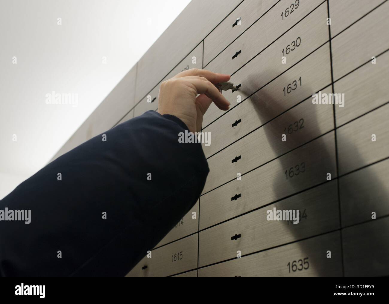 Open a safe in a bank Open locker in a vault of a bank Stock Photo - Alamy