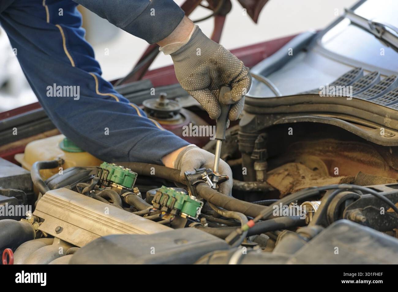 Lpg car injectors in old dusty and dirty car engine is under service ...