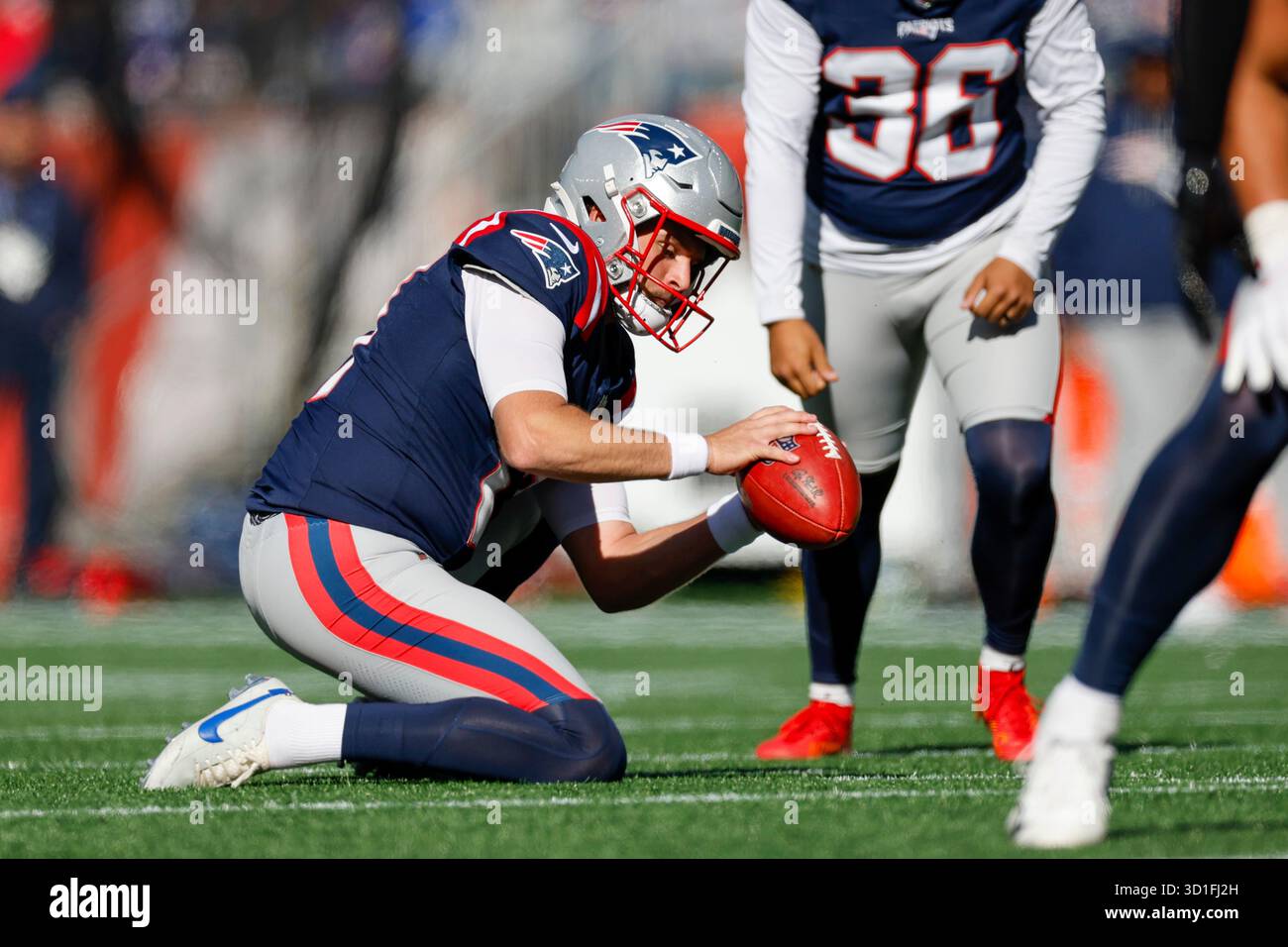 New England Patriots punter Bryce Baringer (17) takes the snap during ...