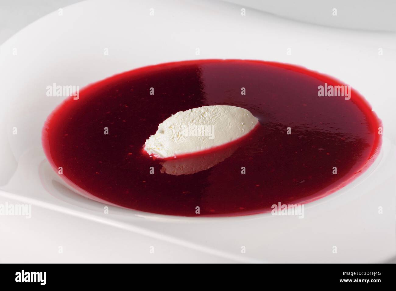 Portion of cold raspberry soup with mascarpone Stock Photo - Alamy