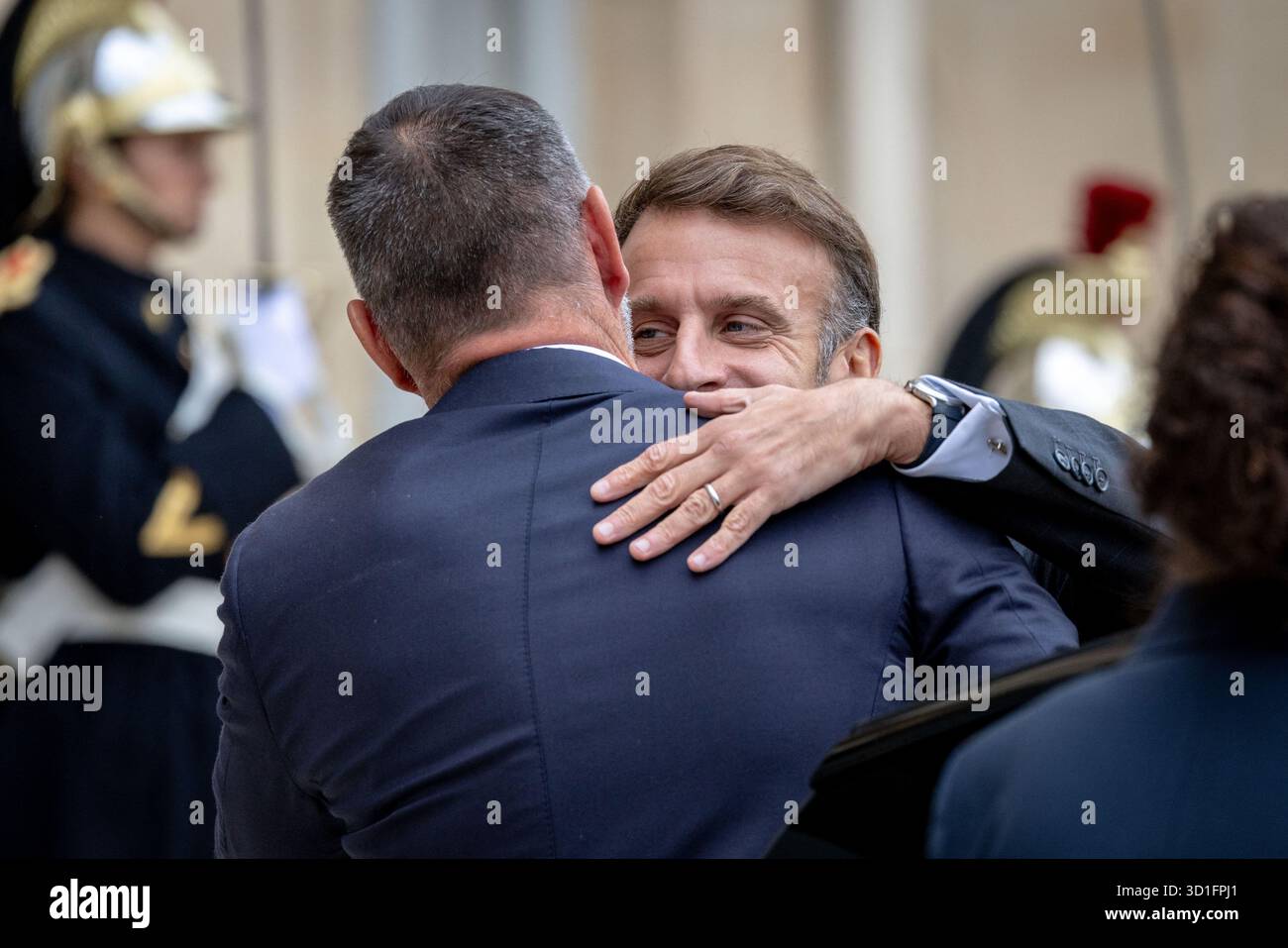 France's President Emmanuel Macron (R) welcomes Prince Rahim al ...