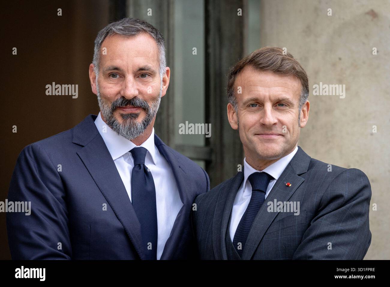France's President Emmanuel Macron (R) welcomes Prince Rahim al ...