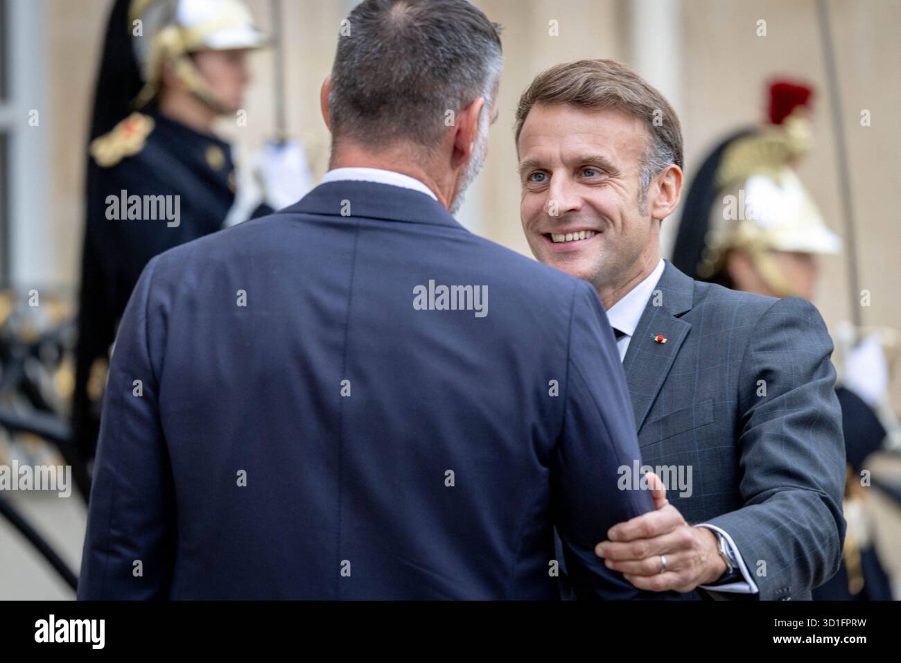 France's President Emmanuel Macron (R) welcomes Prince Rahim al ...