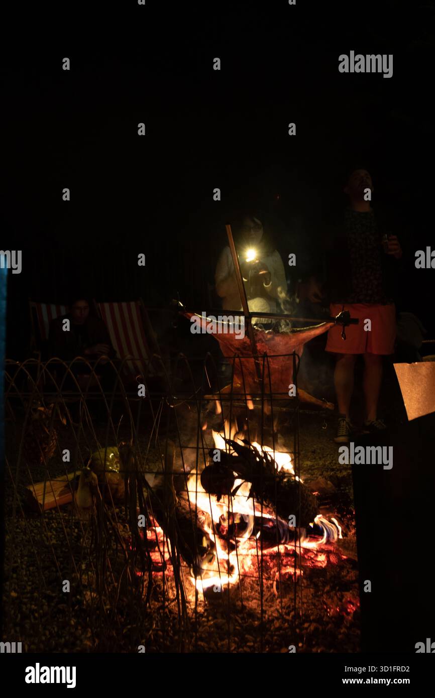 rustic lamb barbecue bbq over open fire in Chile, South America. Asado ...