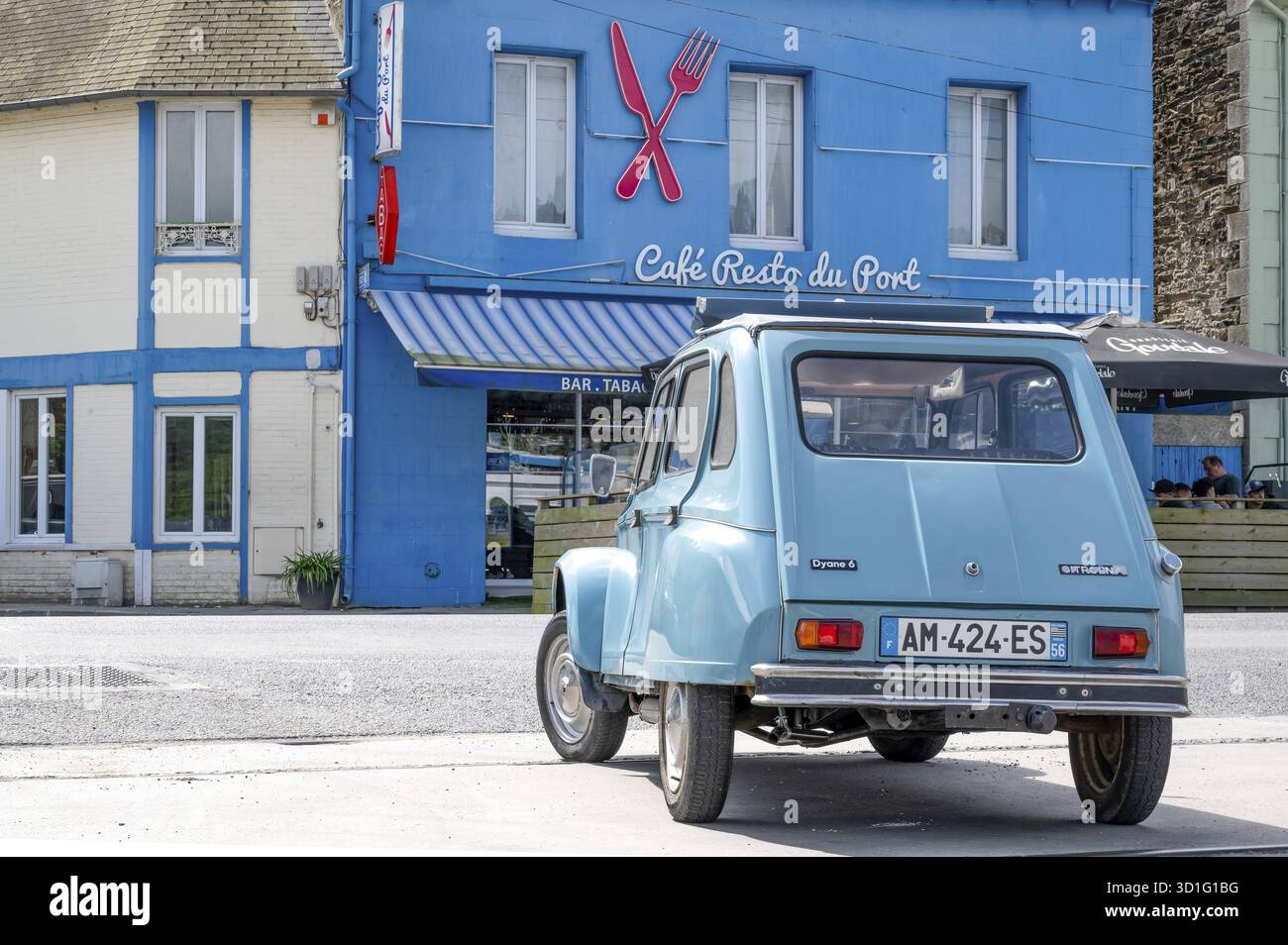 A sky blue Citroen Dyane or 2CV with roll top is parked in front of the ...