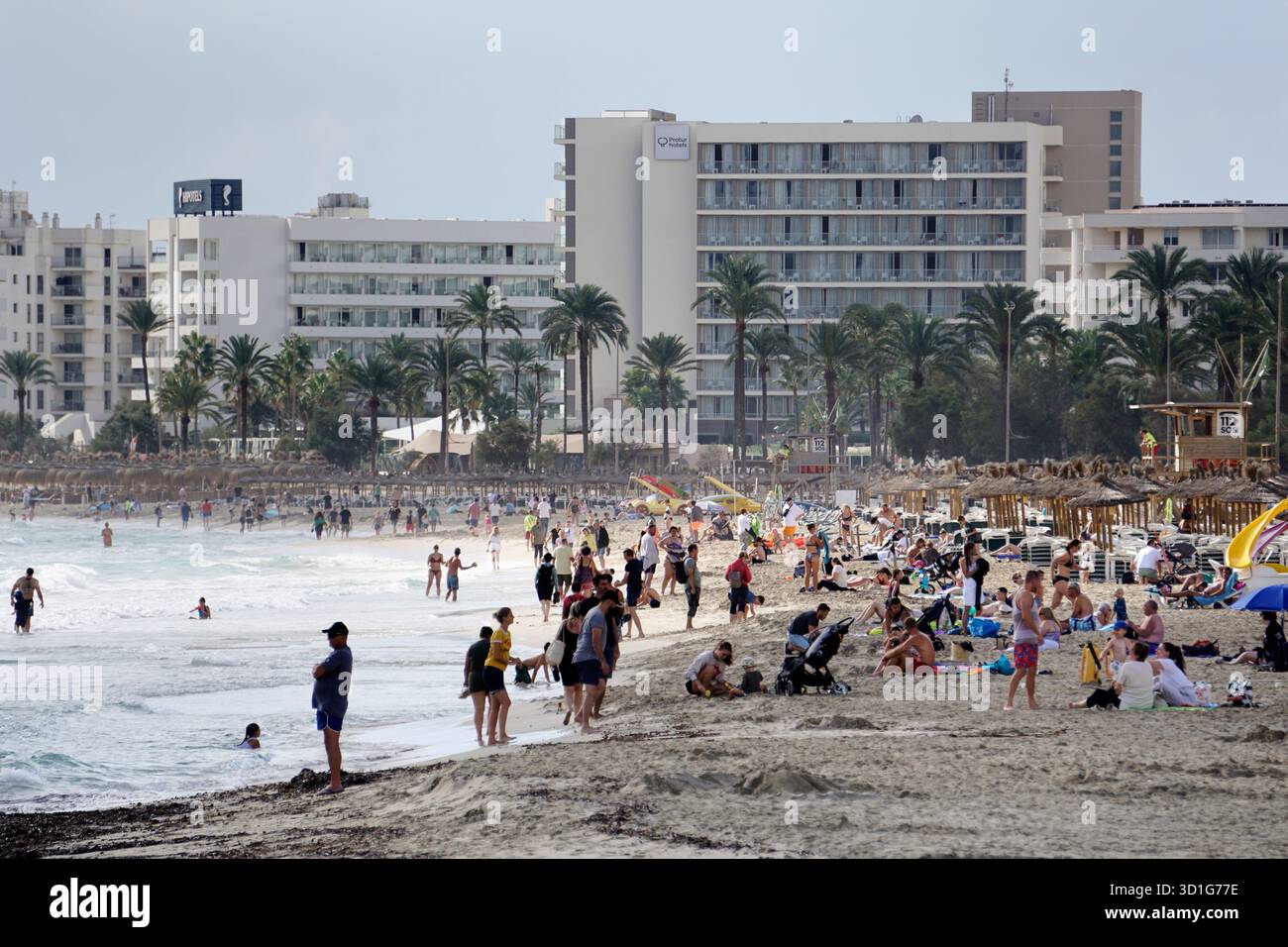 People are at the beach in Cala Millor, Mallorca, Spain, Wednesday, Oct ...