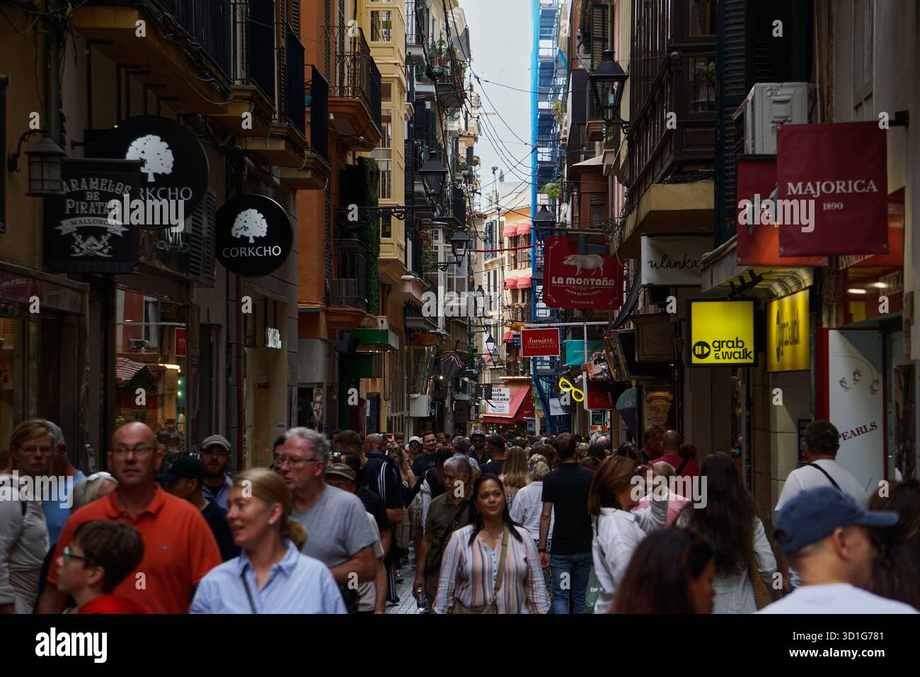People walk on the Carrer de Jaume II in Palma, Mallorca, Spain, Monday ...
