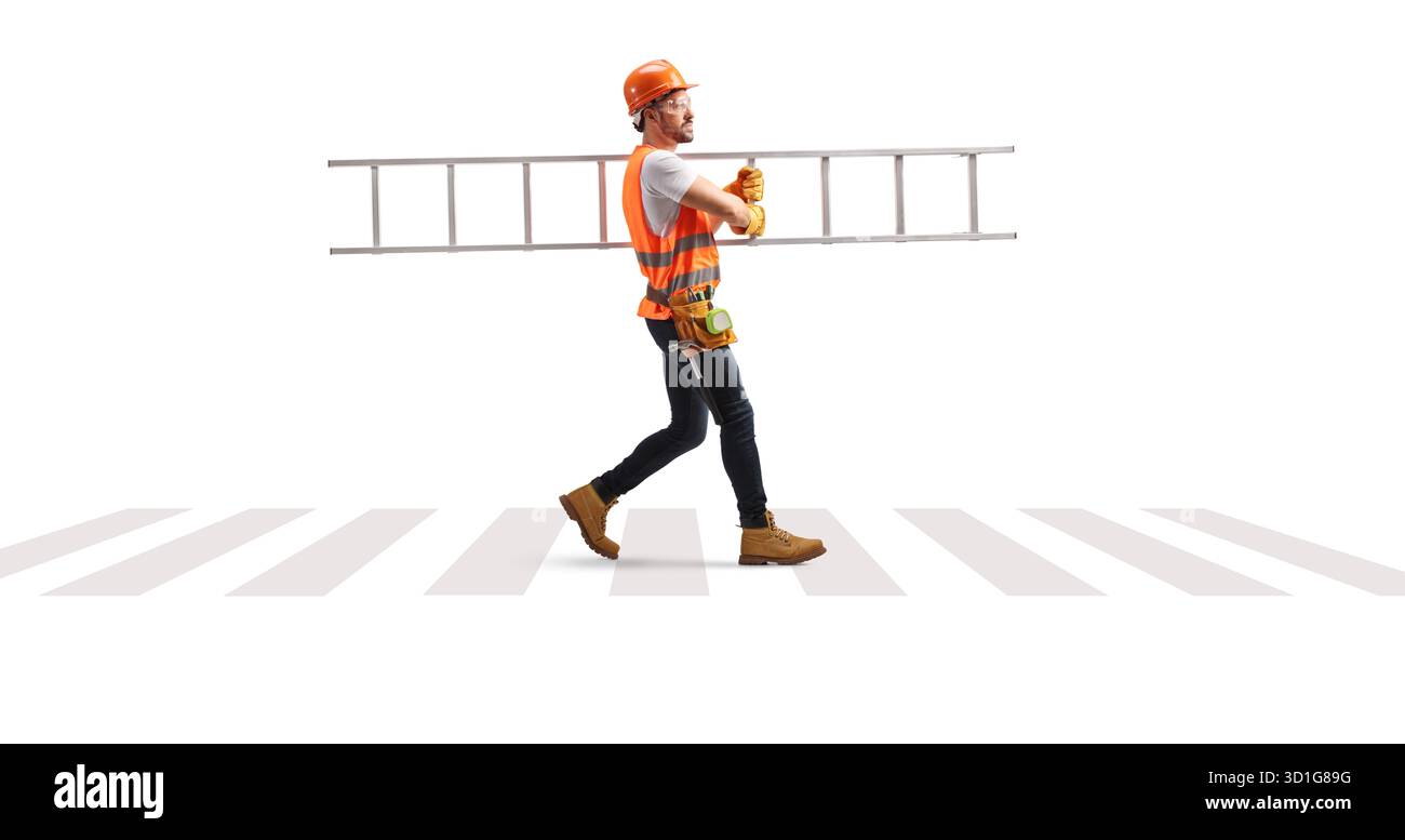 Worker in a reflective vest and helmet carrying a ladder on a zebra ...