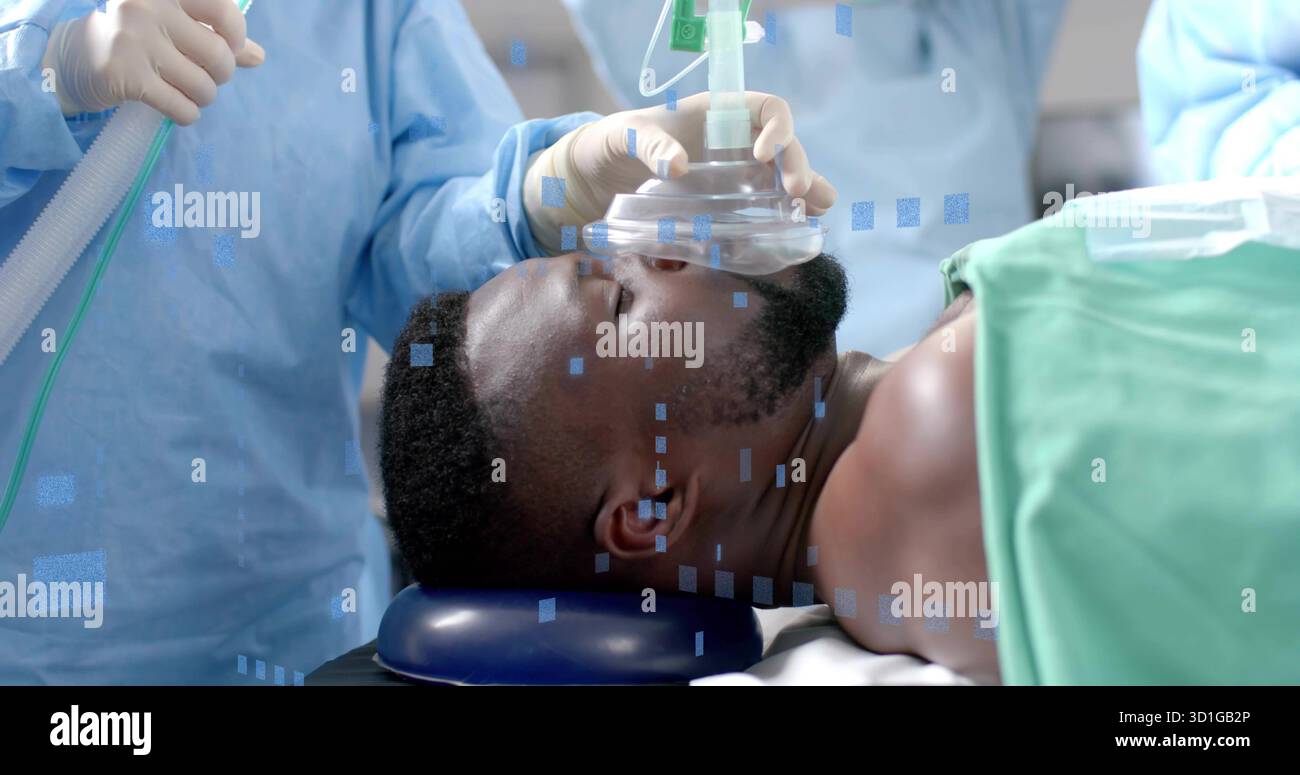 Holding anesthesia mask, staff in scrubs securing patient airway in ...