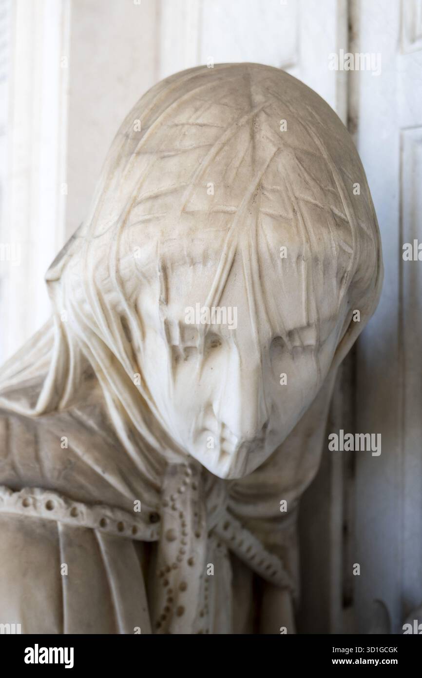 Close-up on the heavily veiled head of a marble mourning woman (Dolente ...