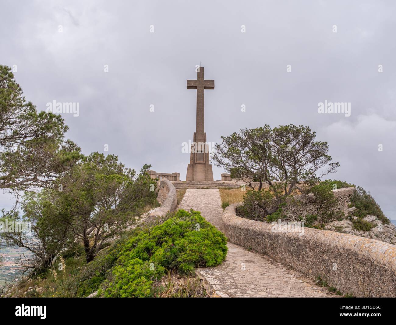 Santuari de Sant Salvador, Mallorca, stone cross stands atop a hill ...