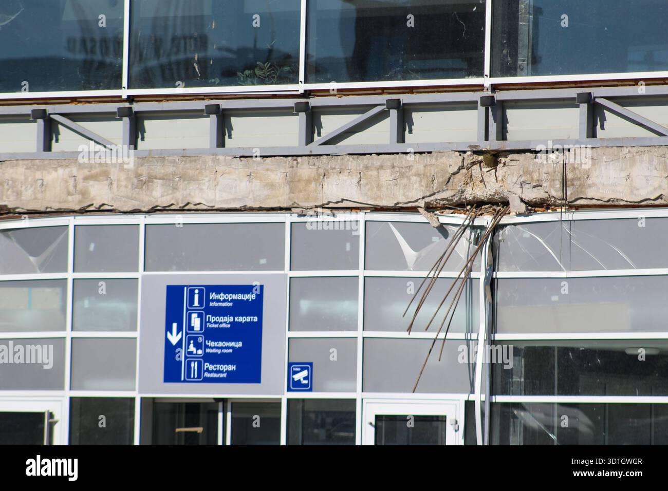 The main entrance of the Novi Sad railway station showing worn ...