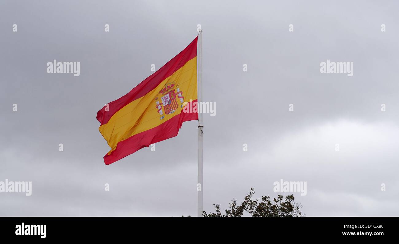Giant Spanish flag waving in the wind in Plaza de Colón, Madrid Stock ...