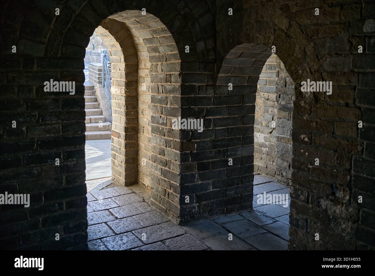 Ancient stone archway passage on Great Wall of China with stairs and ...