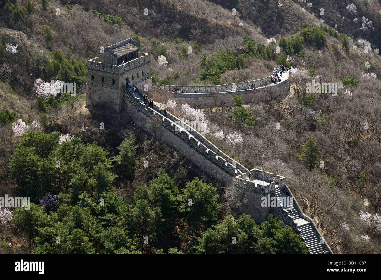 Great Wall aerial view with modern cable car station and visitors on ...