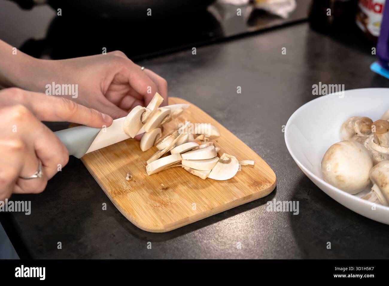 Sliced fresh champignon mushrooms being hi-res stock photography and ...