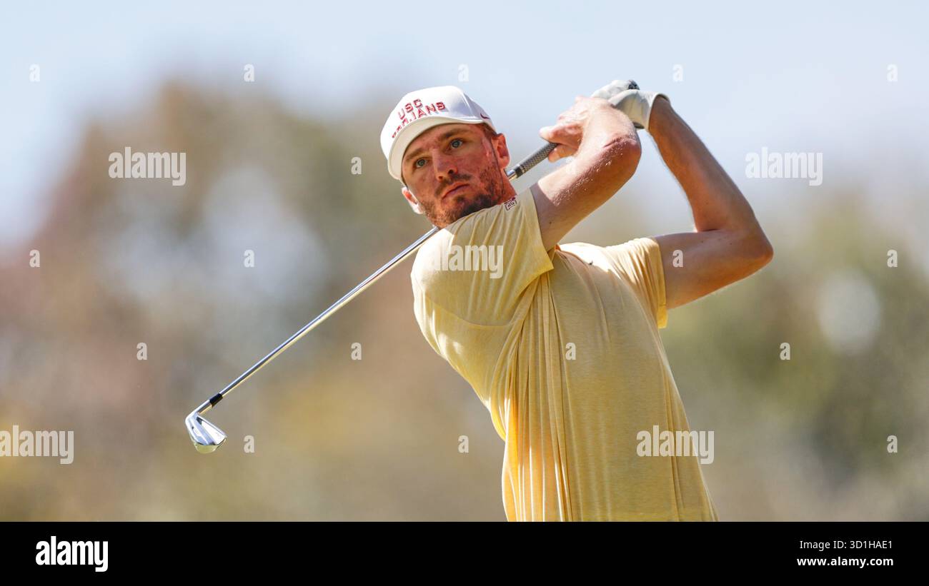 USC golfer Luke Stock hits a tee shot during an NCAA golf tournament on ...