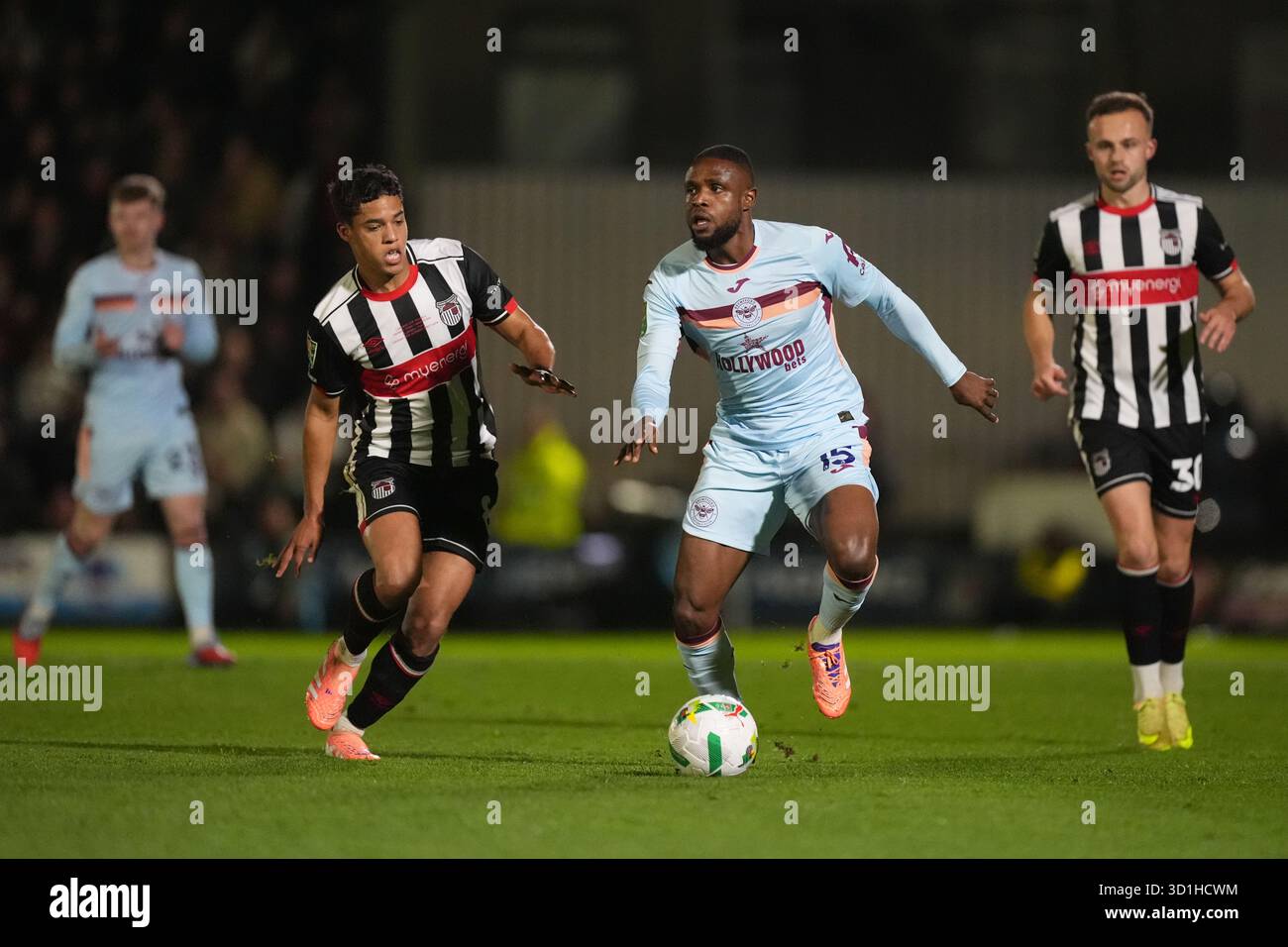 Grimsby Town's Evan Khouri (second from left) and Brentford's Frank ...