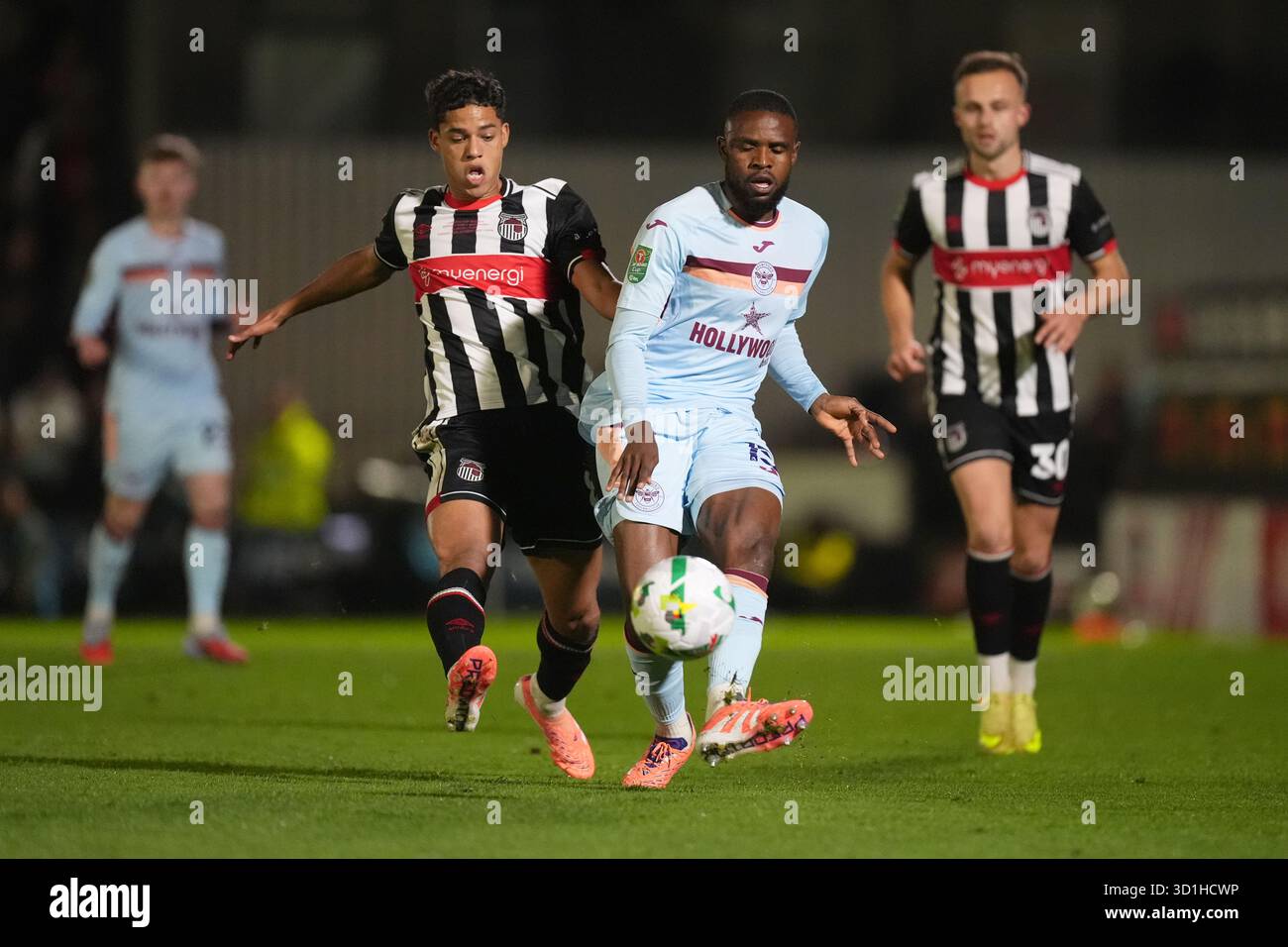 Grimsby Town's Evan Khouri (second from left) and Brentford's Frank ...