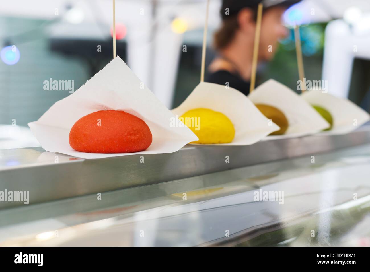 Street fast food, colored burger buns row on counter Stock Photo - Alamy
