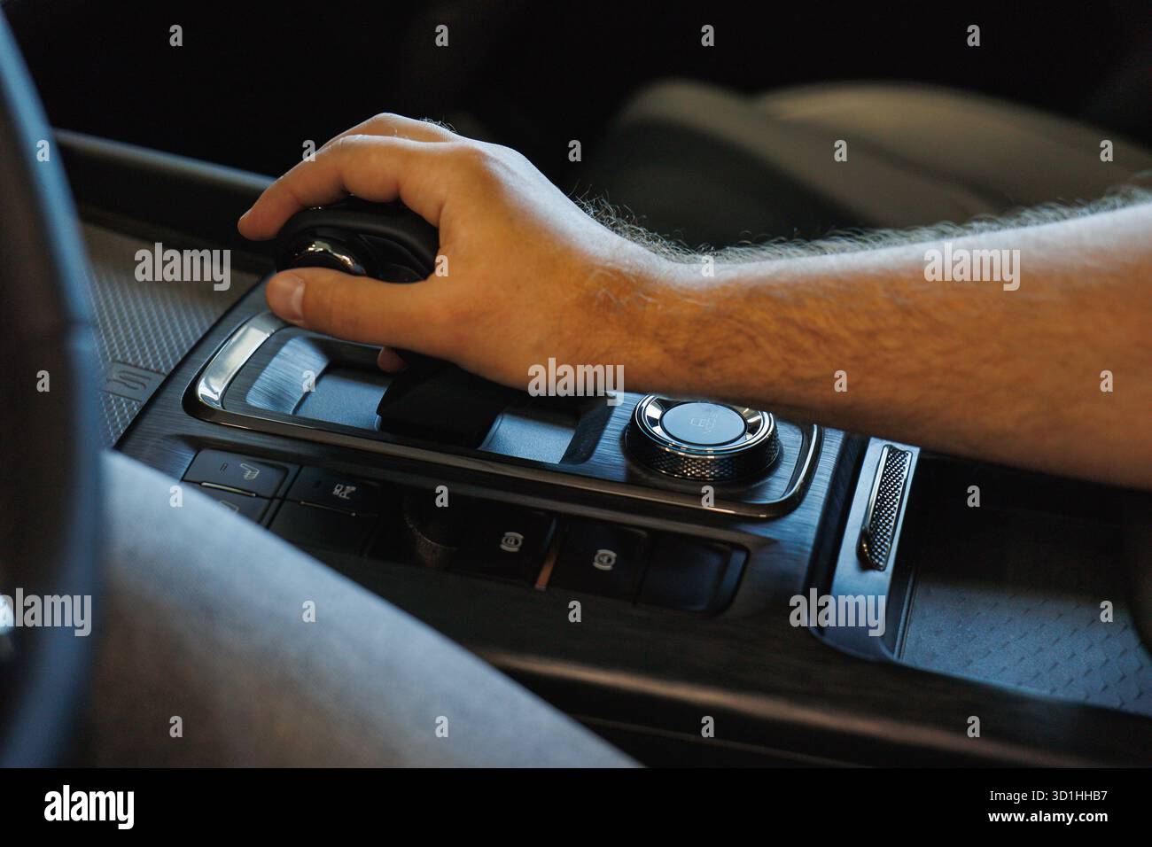 A close-up of a hand reaching for the gear shift Stock Photo - Alamy