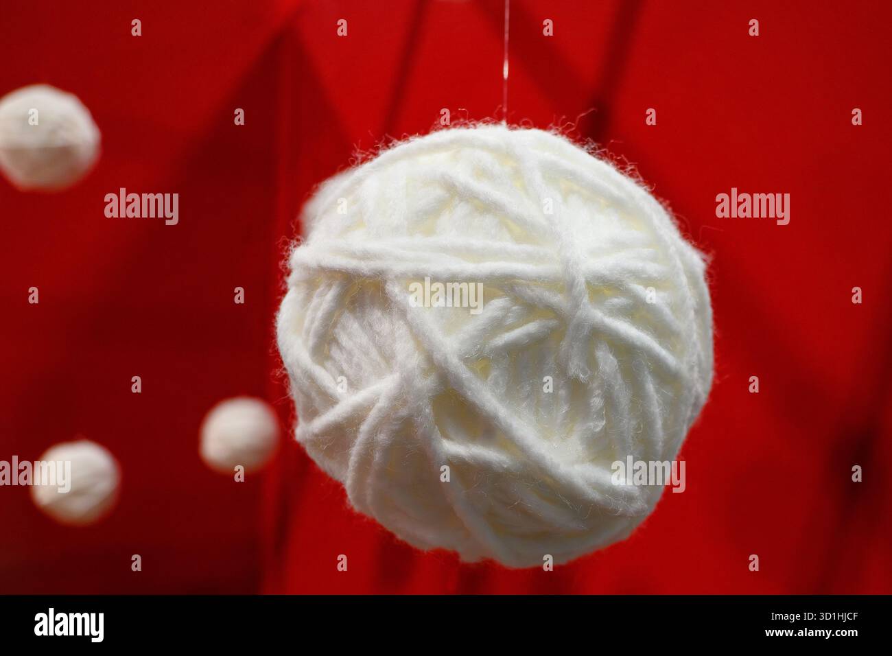 Red woolen skein on hi-res stock photography and images - Alamy