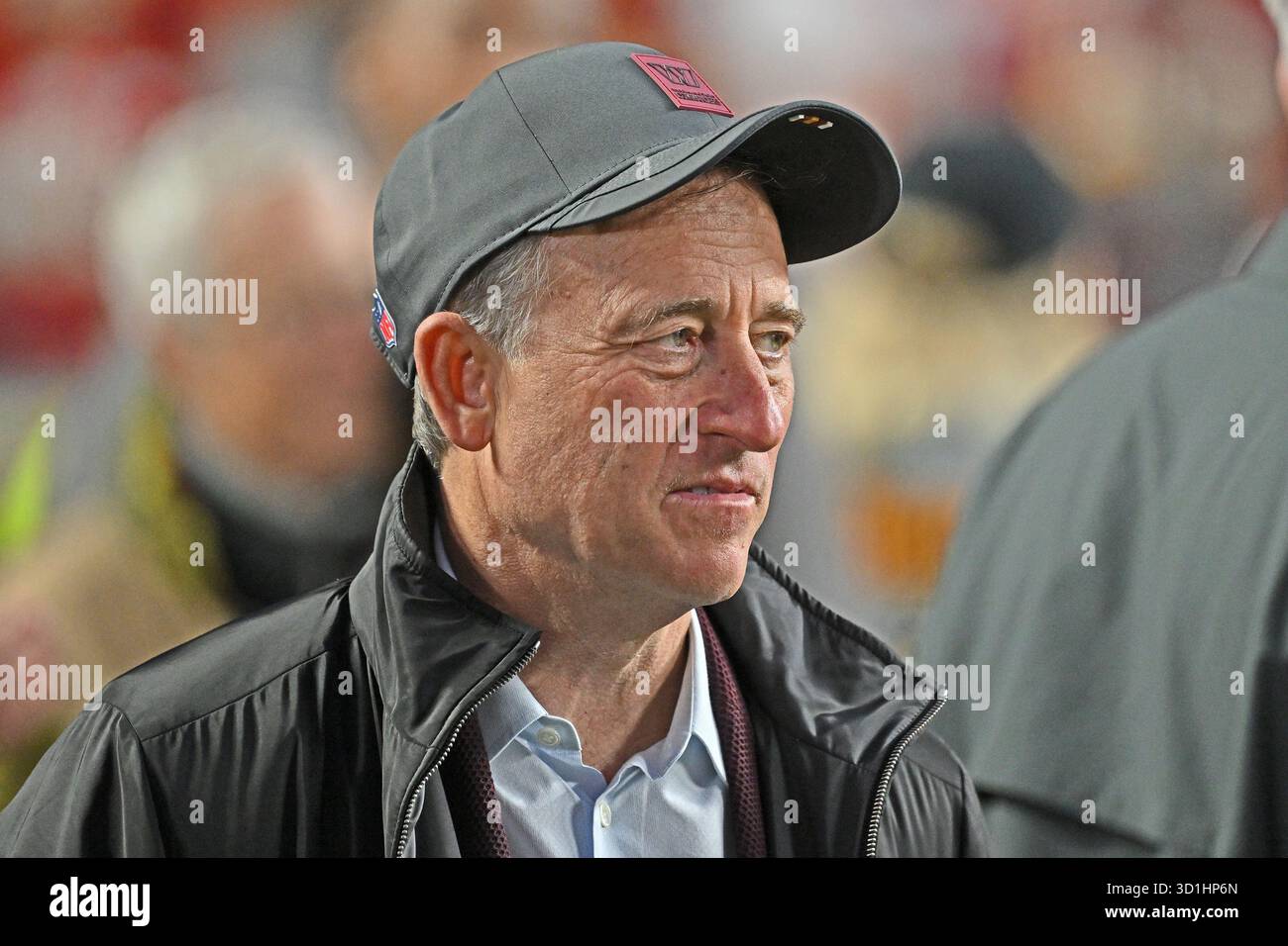 Washington Commanders team owner Josh Harris look on while on the field ...