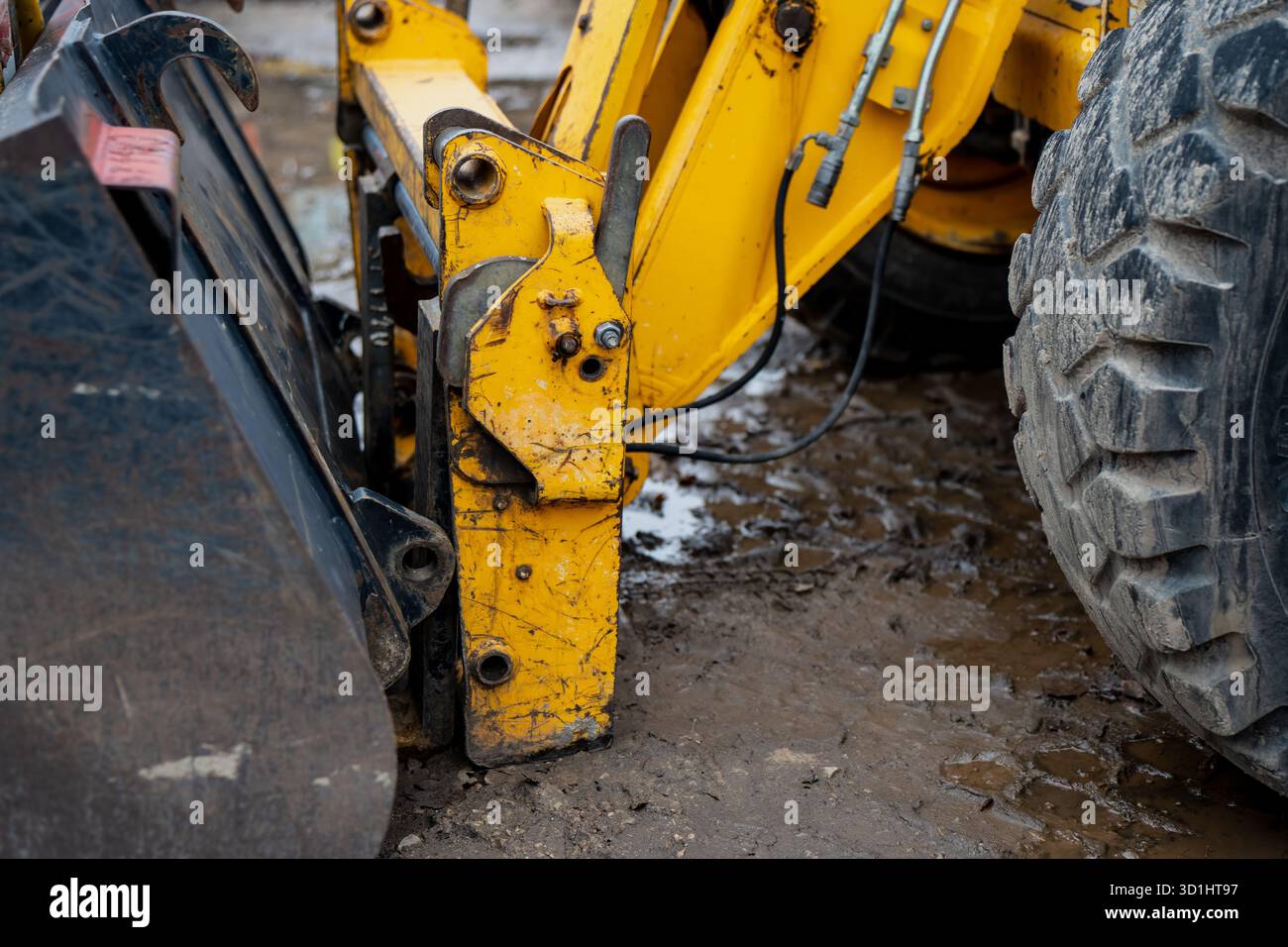 Yellow hydraulic excavator arm with attachment coupling and front ...