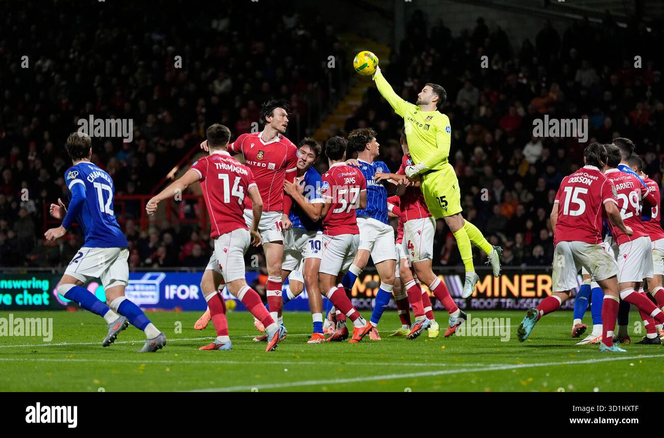 Wrexham goalkeeper Callum Burton saves a cross during the Carabao Cup ...