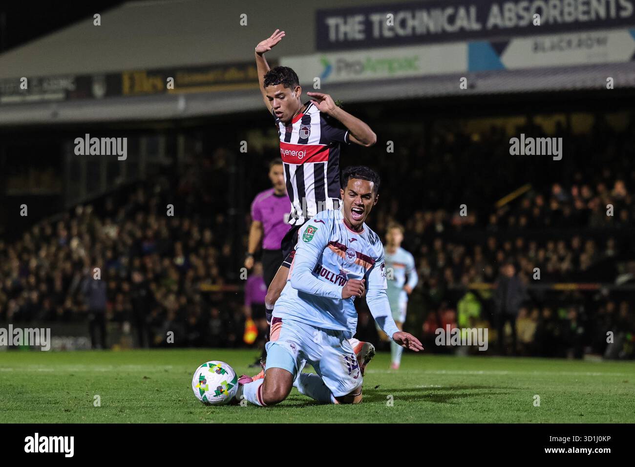 Evan Khouri of Grimsby Town brings Fabio Carvalho of Brentford down in ...