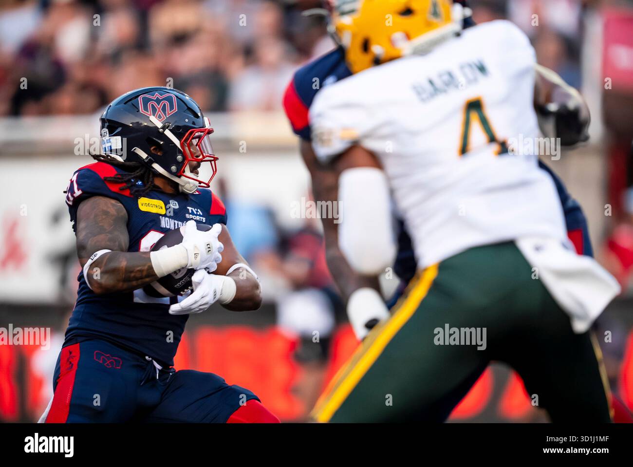 Le porteur de ballon des Alouettes de Montréal Sean Thomas Erlington ...