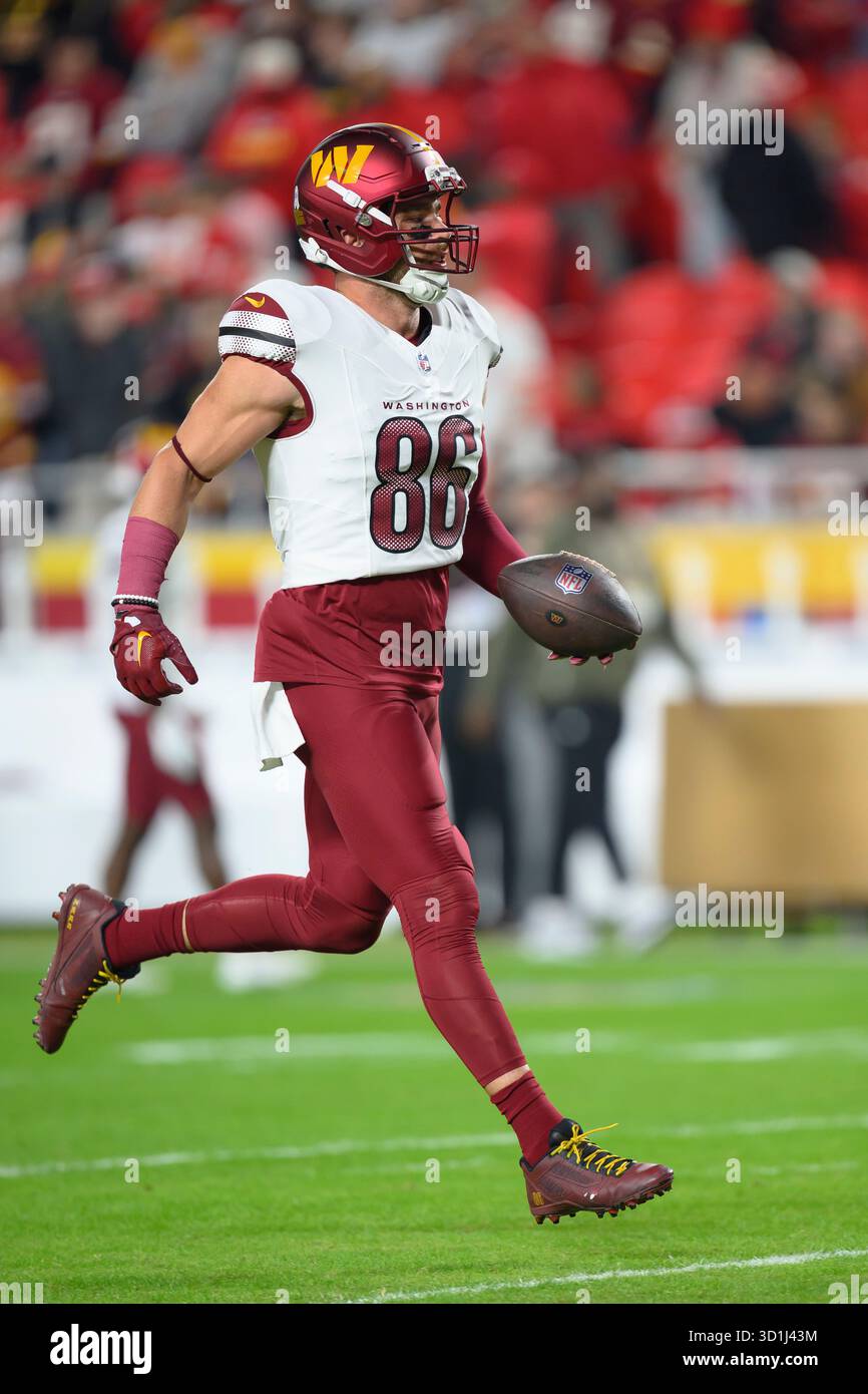 Washington Commanders tight end Zach Ertz runs with the ball after a ...