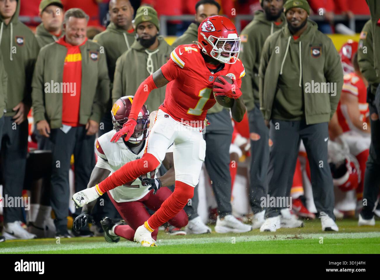 Kansas City Chiefs wide receiver Xavier Worthy (1) avoids a tackle by ...
