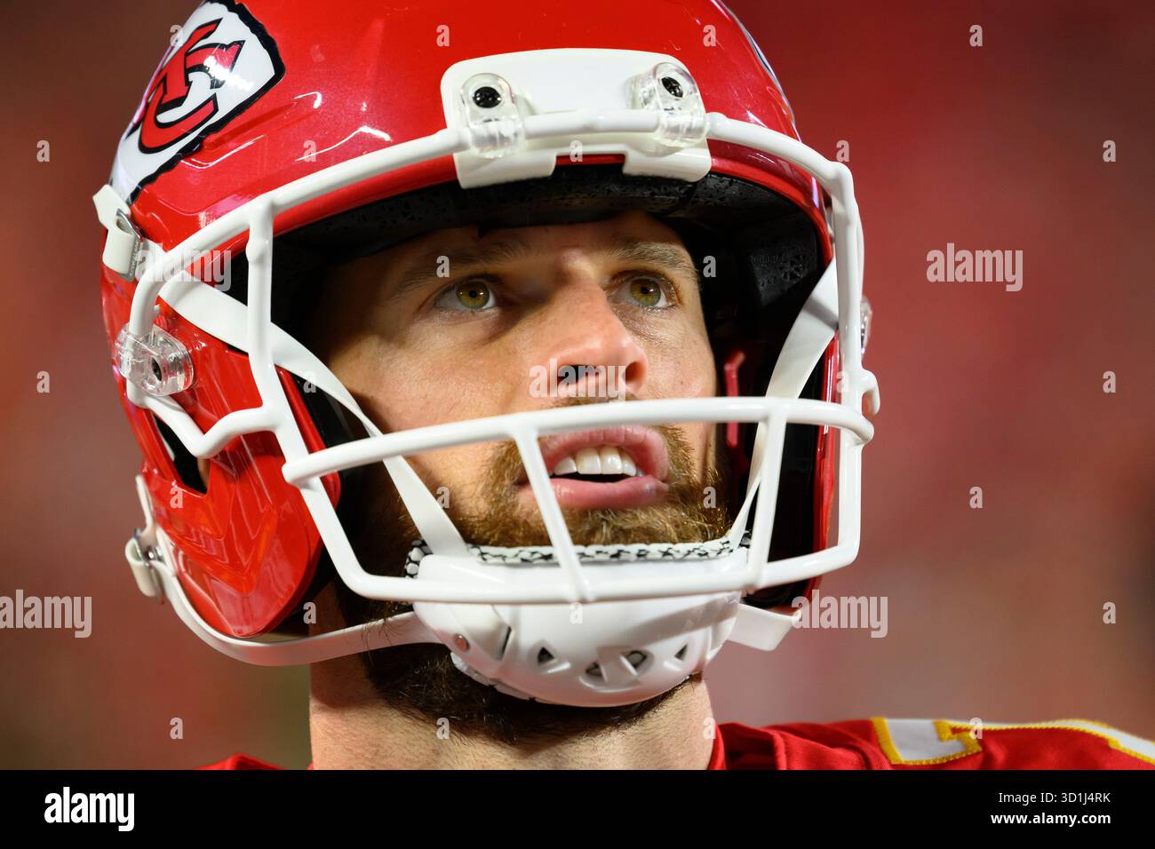 Kansas City Chiefs place kicker Harrison Butker looks to the scoreboard ...