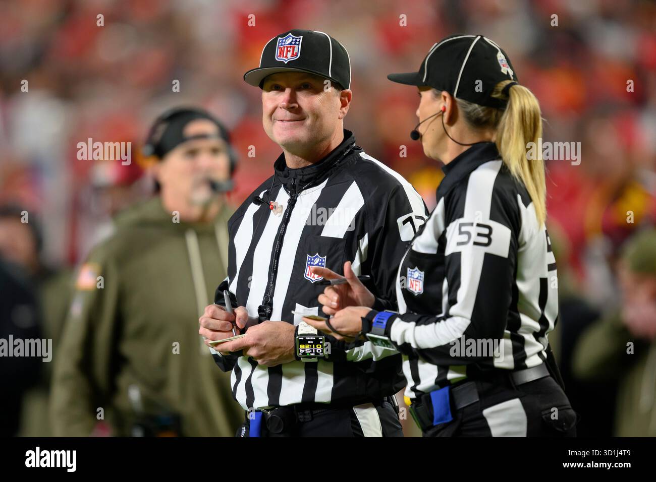 Side judge Chad Hill, left, and down judge Sarah Thomas (53) confer ...