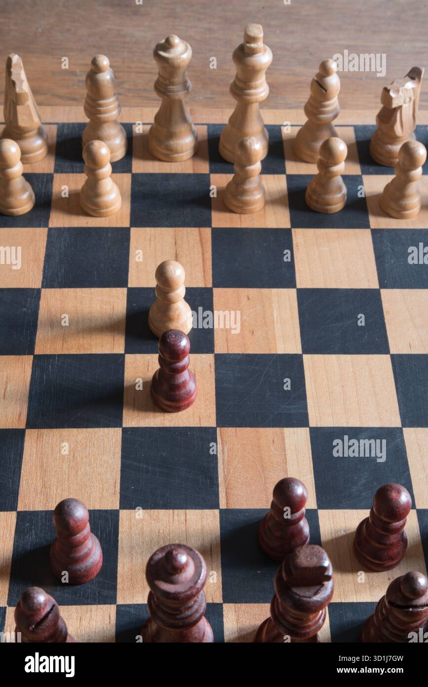 Wooden chess pieces start game on a classic chessboard Stock Photo - Alamy
