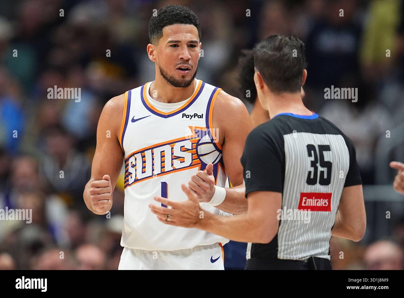 Phoenix Suns guard Devin Booker (1) argues for a call with referee in ...