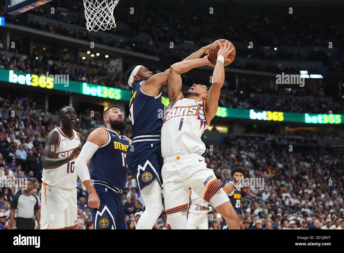 Denver Nuggets guard Bruce Brown (11) blocks a shot by Phoenix Suns ...