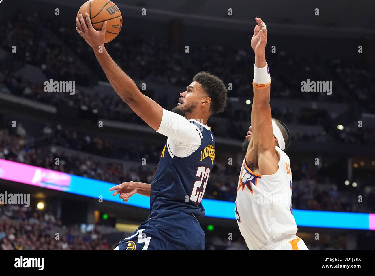 Denver Nuggets forward Cameron Johnson (23) drives past Phoenix Suns ...