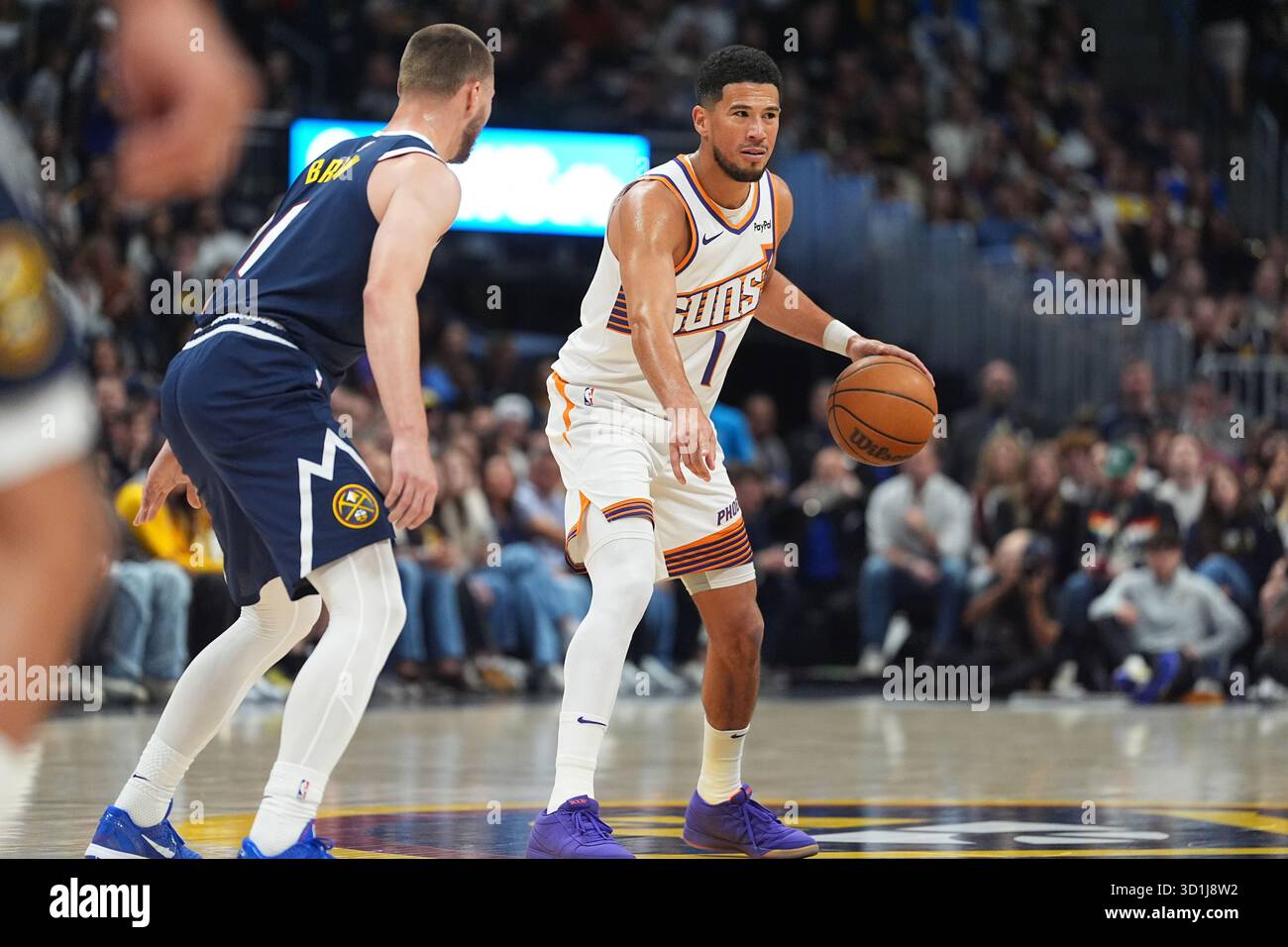 Phoenix Suns guard Devin Booker (1) and Denver Nuggets forward ...
