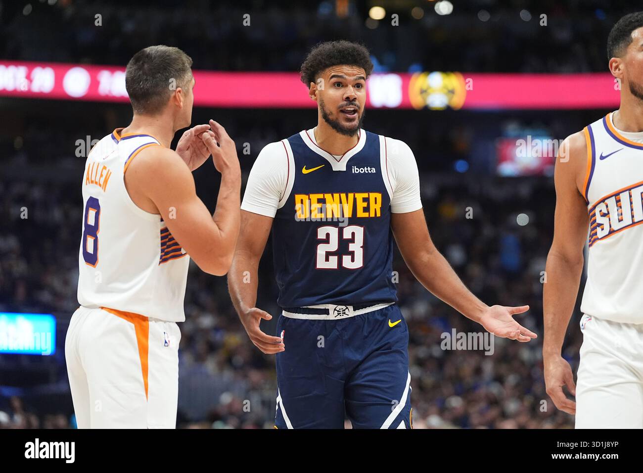 Denver Nuggets forward Cameron Johnson (23) and Phoenix Suns guard ...