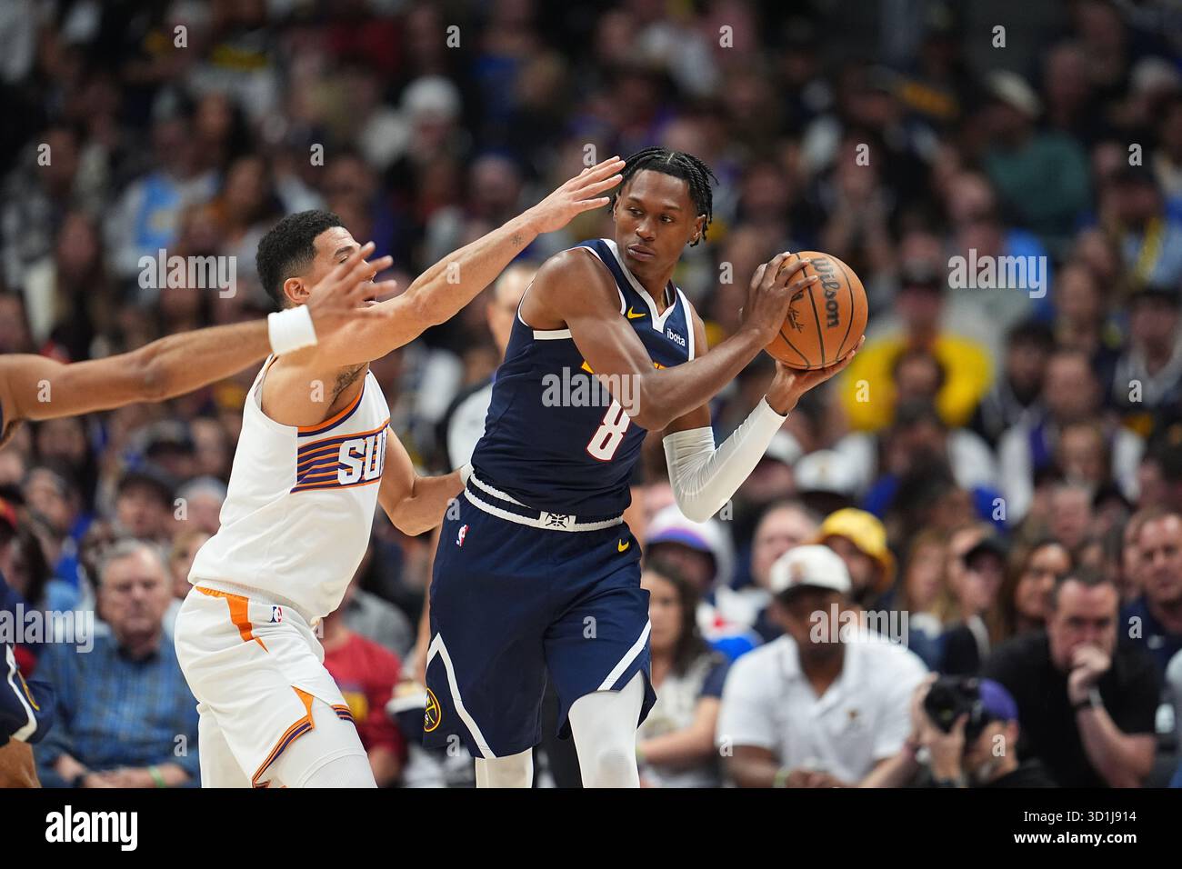 Denver Nuggets guard Peyton Watson (8) looks to pass the ball as ...