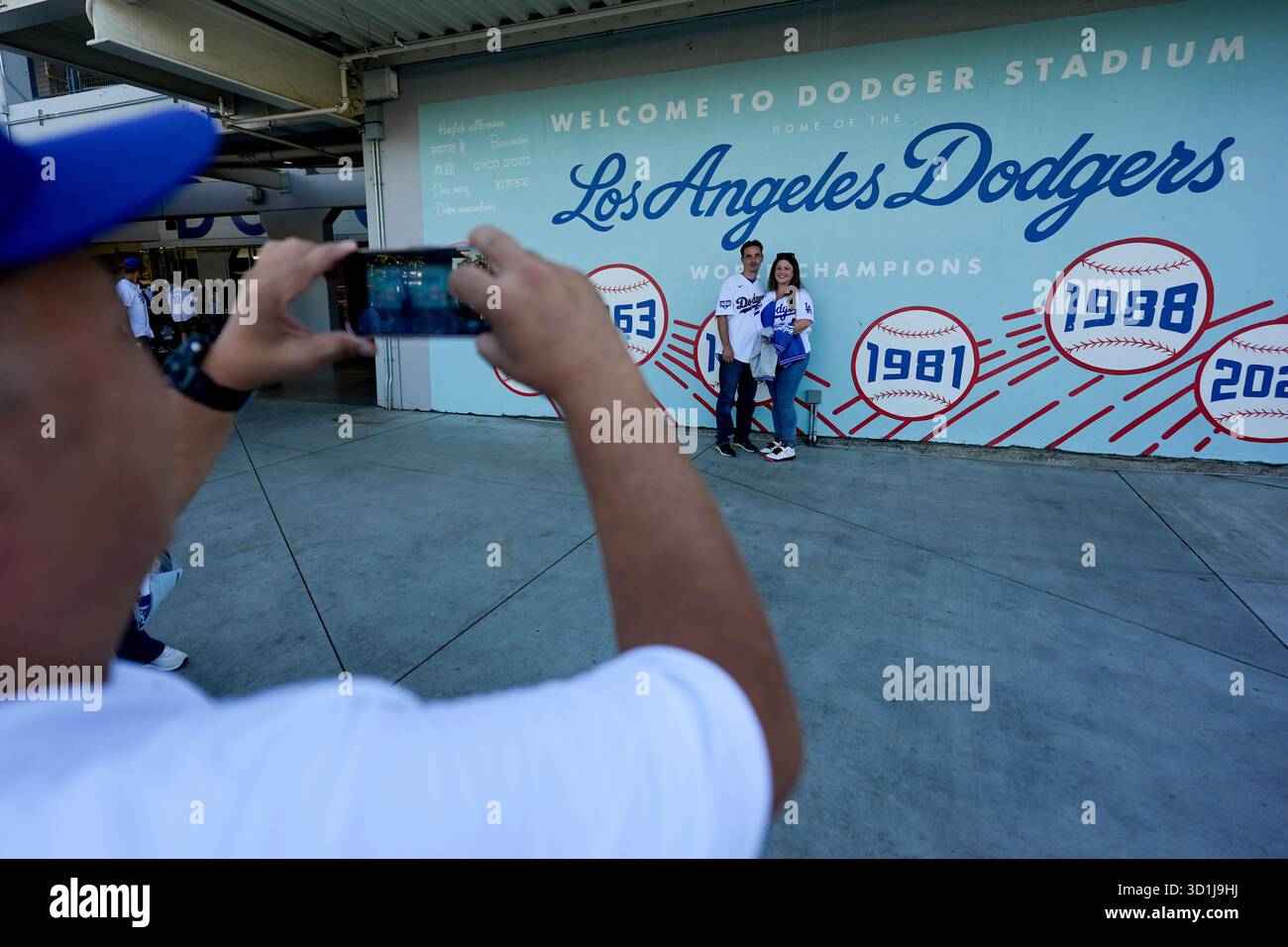 Fans take selfies outside Dodger Stadium prior to Game 4 of baseball's ...