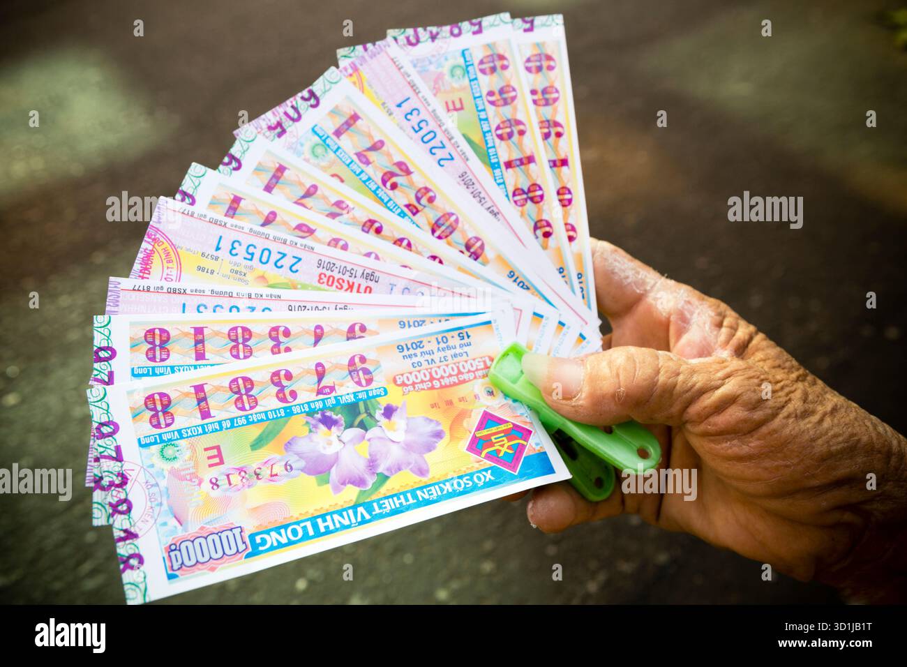 Ho Chi Minh City, Vietnam - January 14, 2016: A lottery ticket seller ...
