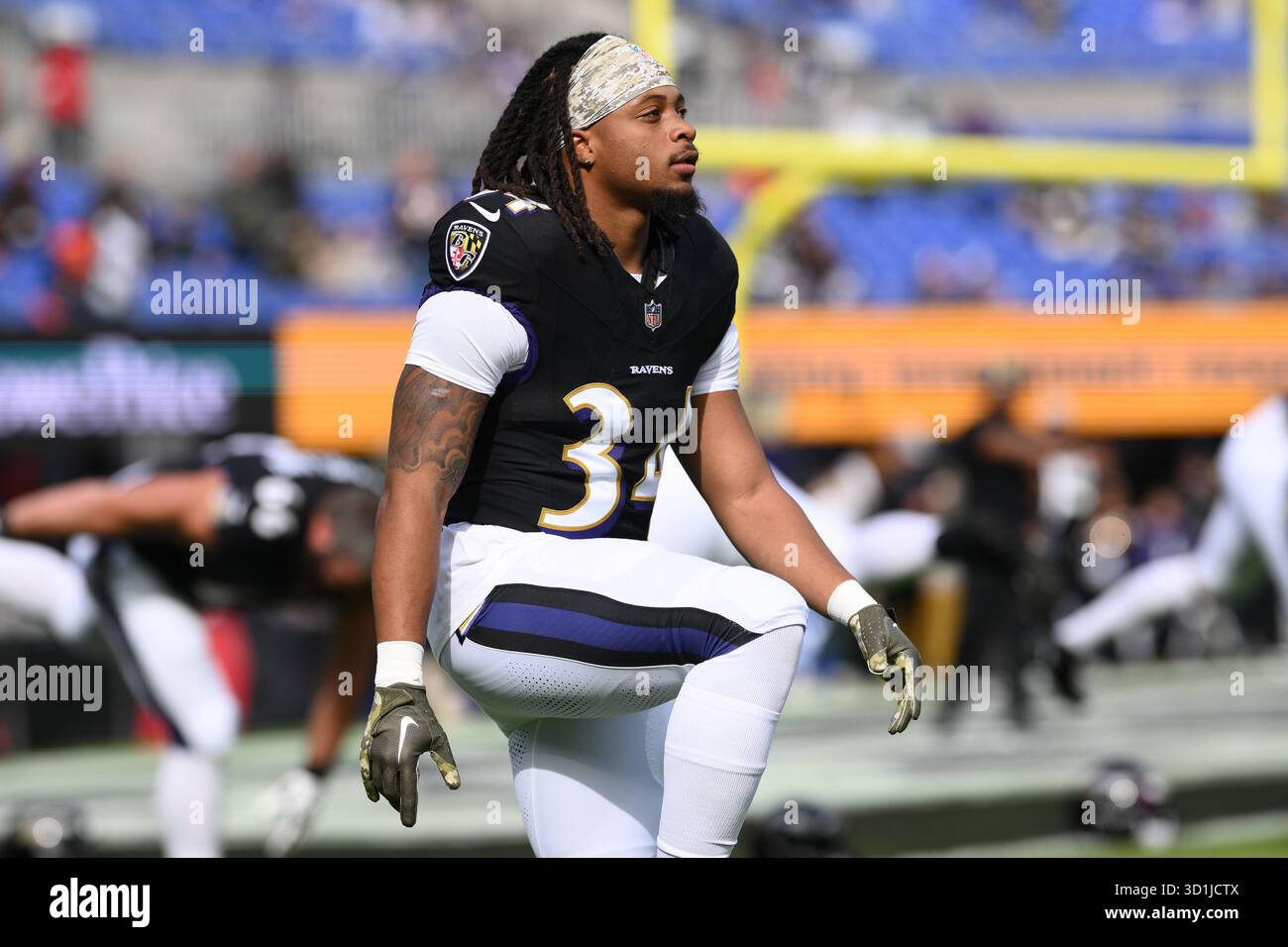 Baltimore Ravens running back Keaton Mitchell (34) warms up before an ...