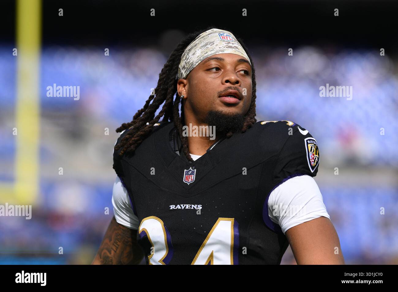 Baltimore Ravens running back Keaton Mitchell (34) warms up before an ...